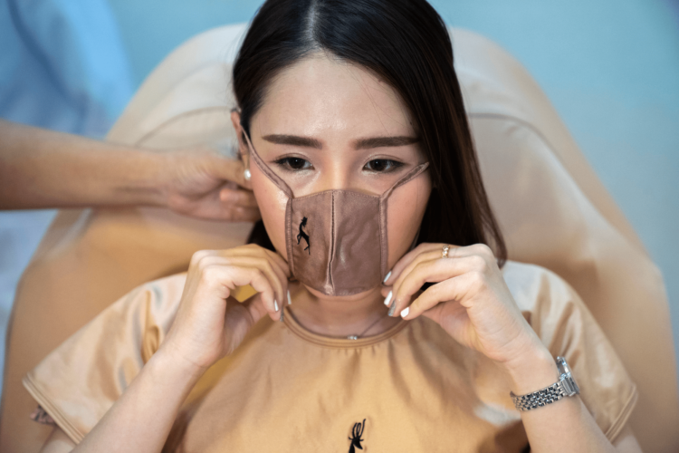 Beauty Clinic In Bangkok Offers Mini Face Masks To Wear During Facials
