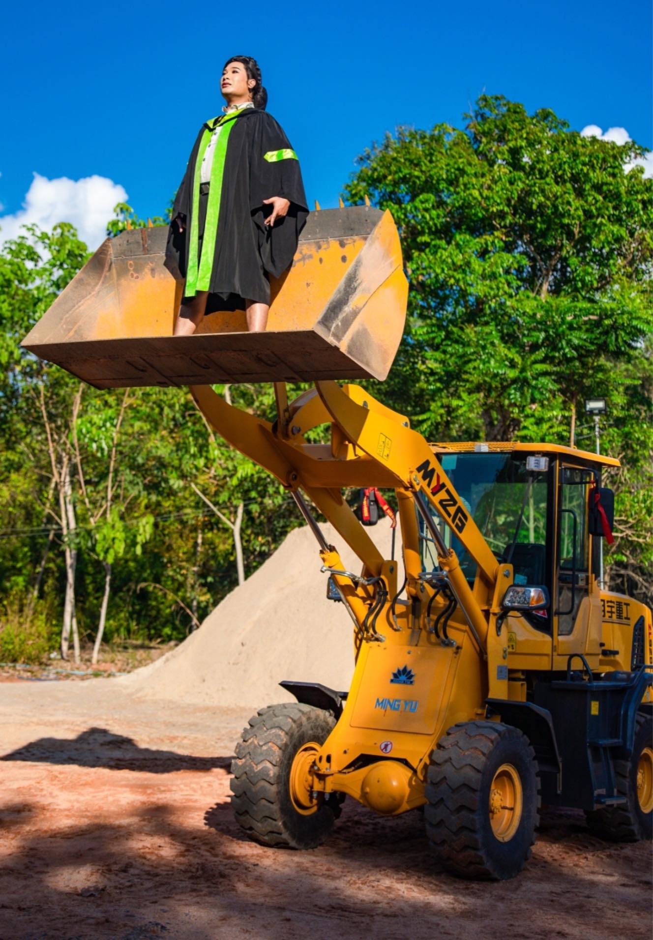 Fabulous Graduate Poses With Tractor, Netizens Praise Her Creativity