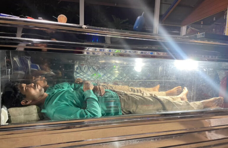 Thai Salesman Sleeps In Coffins To QC For Customers